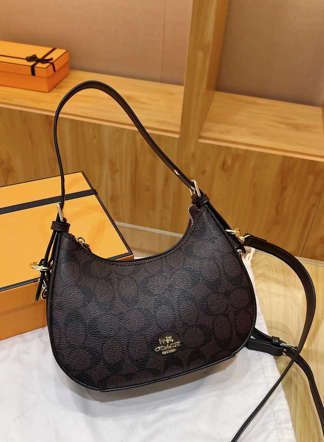 General COACH Printed crescent shaped underarm bag | Best Price UAE ...
