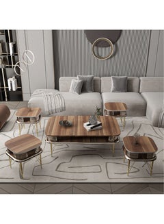 ZAHRAT ALFKHAMAH A set of tables consisting of a large coffee table and ...