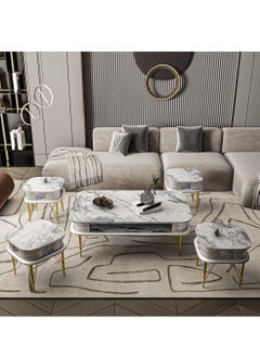 ZAHRAT ALFKHAMAH A set of tables consisting of a large coffee table and ...