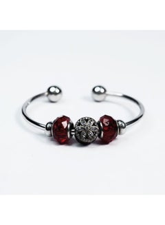 Generic stainless steel bracelet with a palm and red engraved stone ...